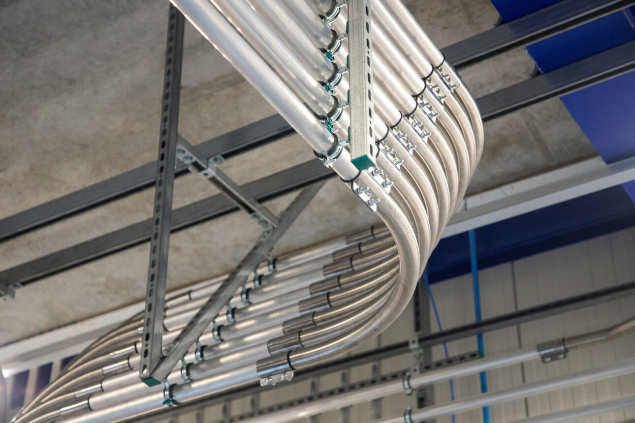 Delivering supports for a complex factory pipework system